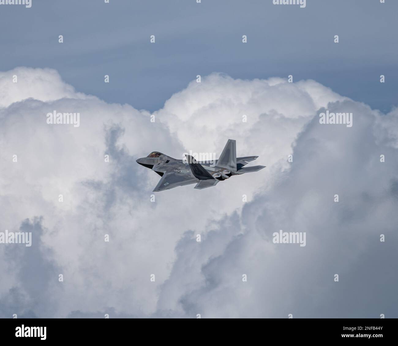 The F-22 Raptor in mid-flight against a clouded sky Stock Photo - Alamy