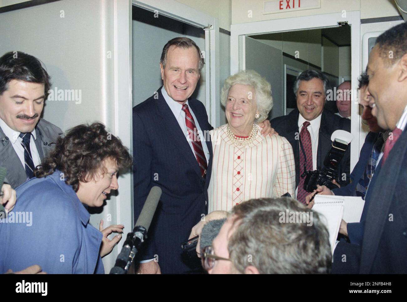 President George Bush and first lady Barbara Bush meet reporters aboard ...