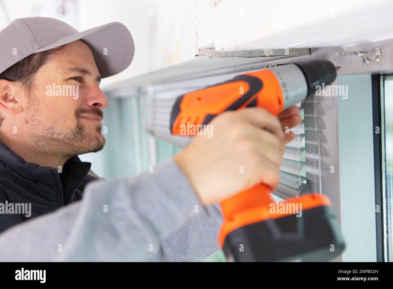 Installing window blinds hi-res stock photography and images - Alamy
