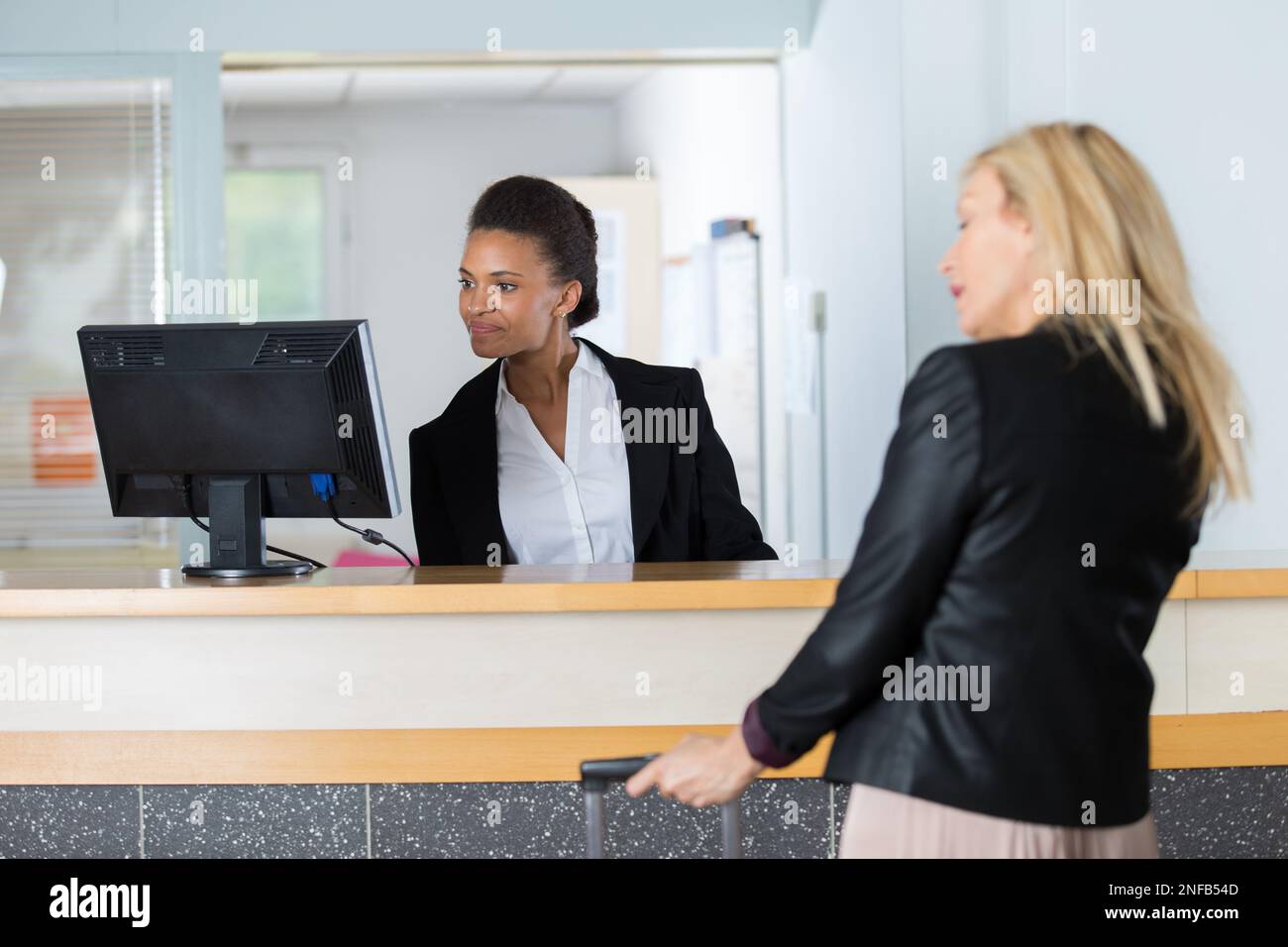 Guest check in hi-res stock photography and images - Alamy