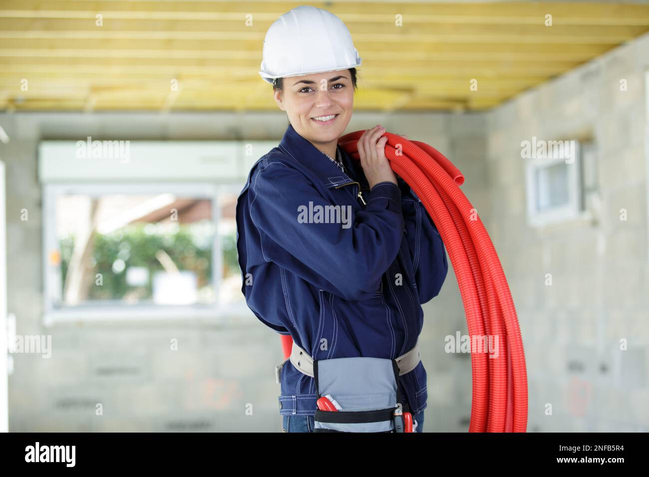 Construction worker carrying pipes hi-res stock photography and images ...