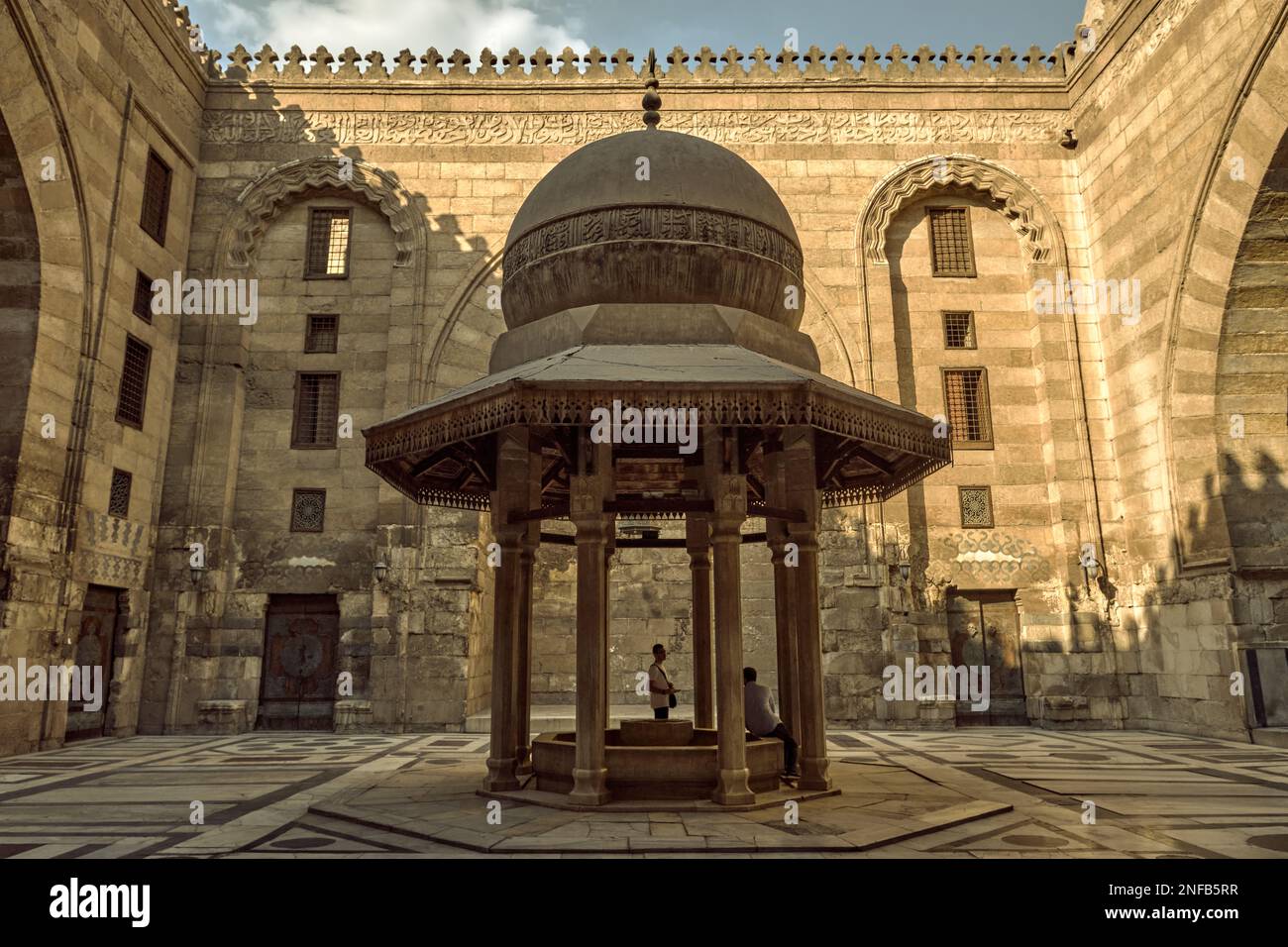 A Medieval Cairo's mosque-madrasa with intricate decorations and ...