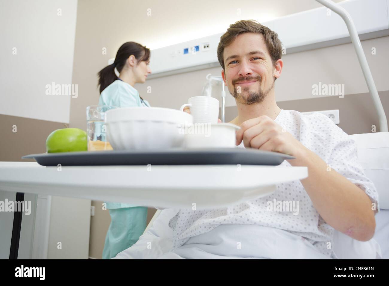 Man eating on hospital bed hi-res stock photography and images - Alamy