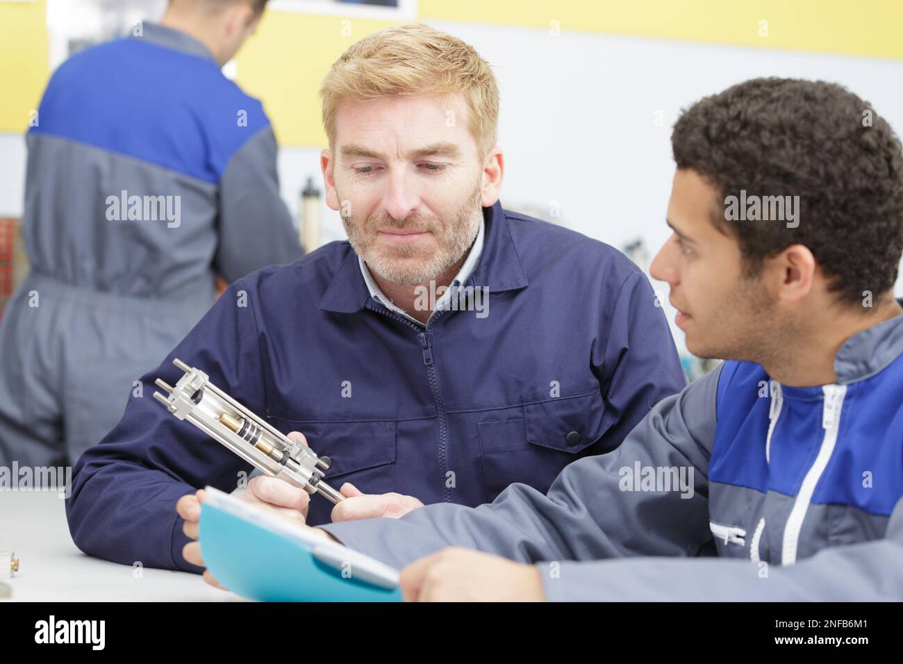 two men in a workshop Stock Photo - Alamy