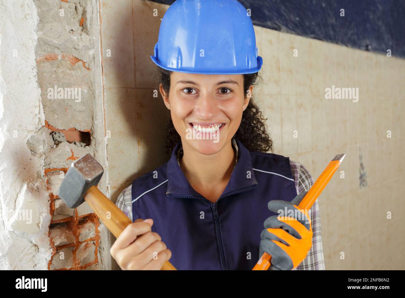 woman with hammer and chisel in the work Stock Photo - Alamy