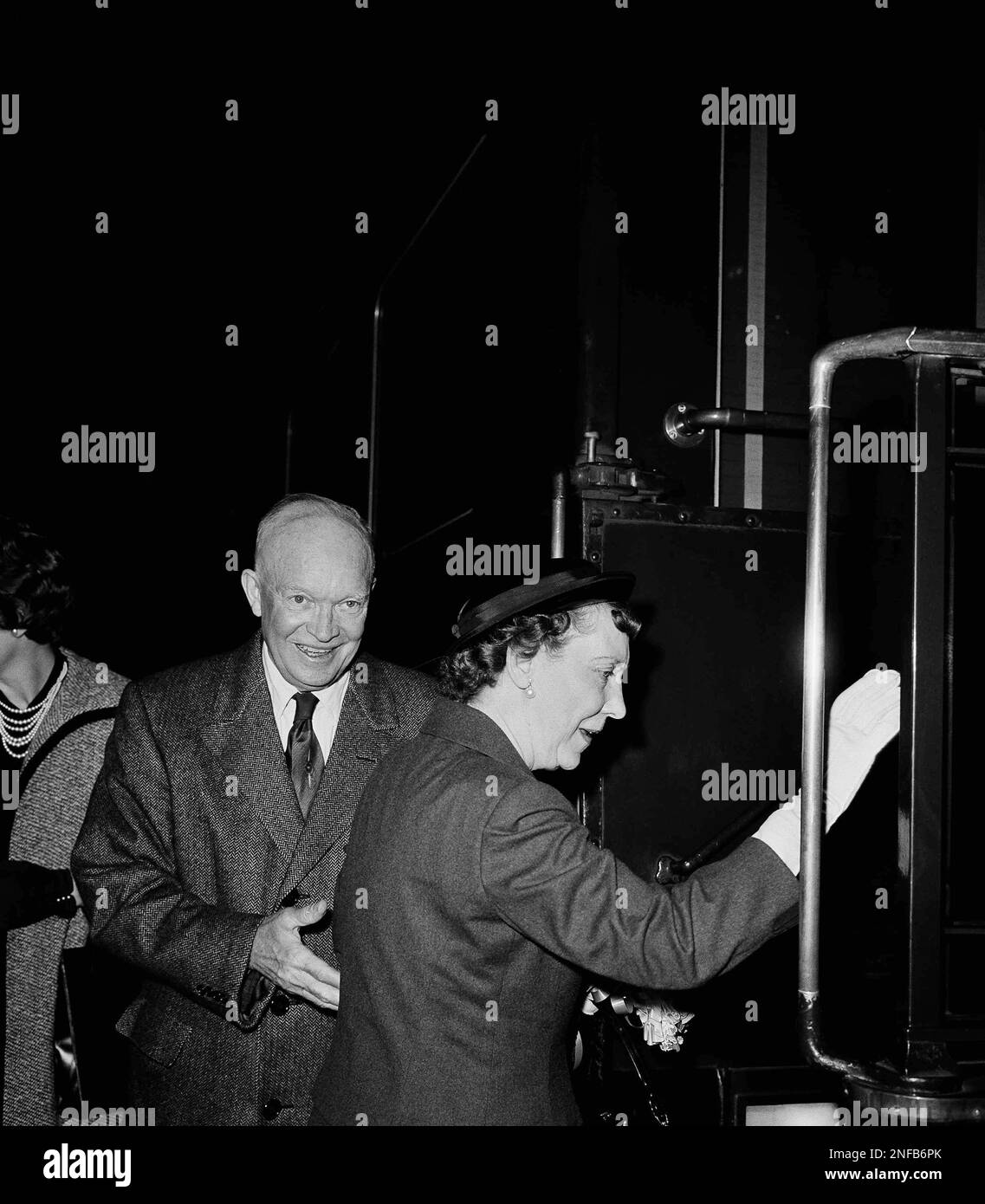 President Dwight Eisenhower lends a helping hand to first lady Mamie ...