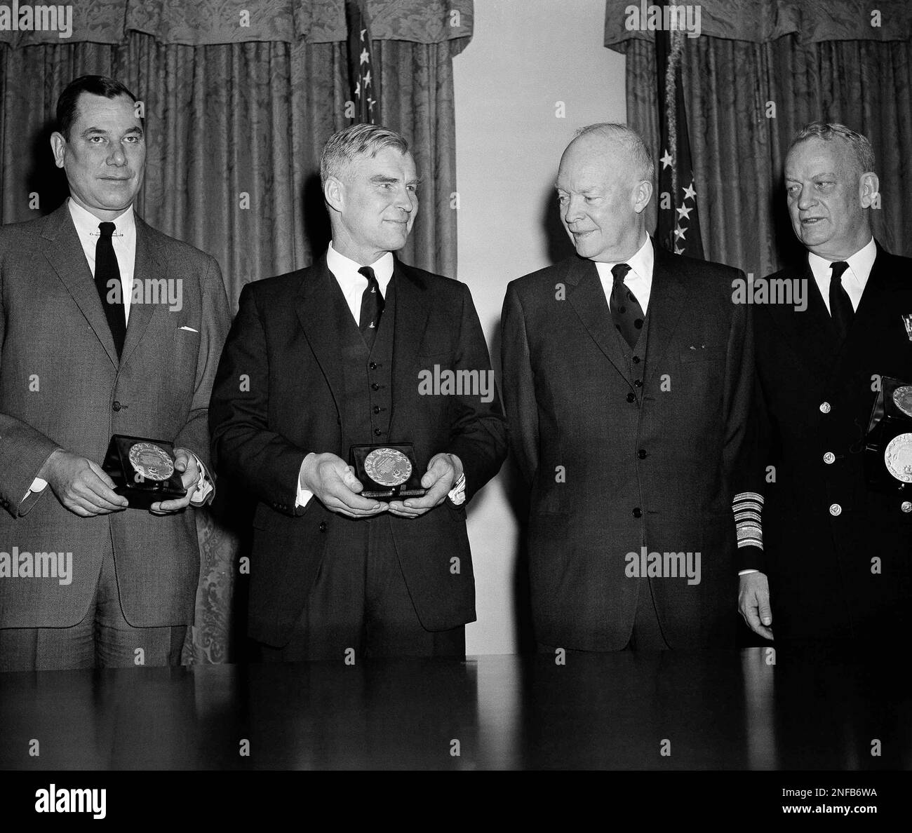 Holding the Hubbard Medals presented by President Dwight Eisenhower on ...