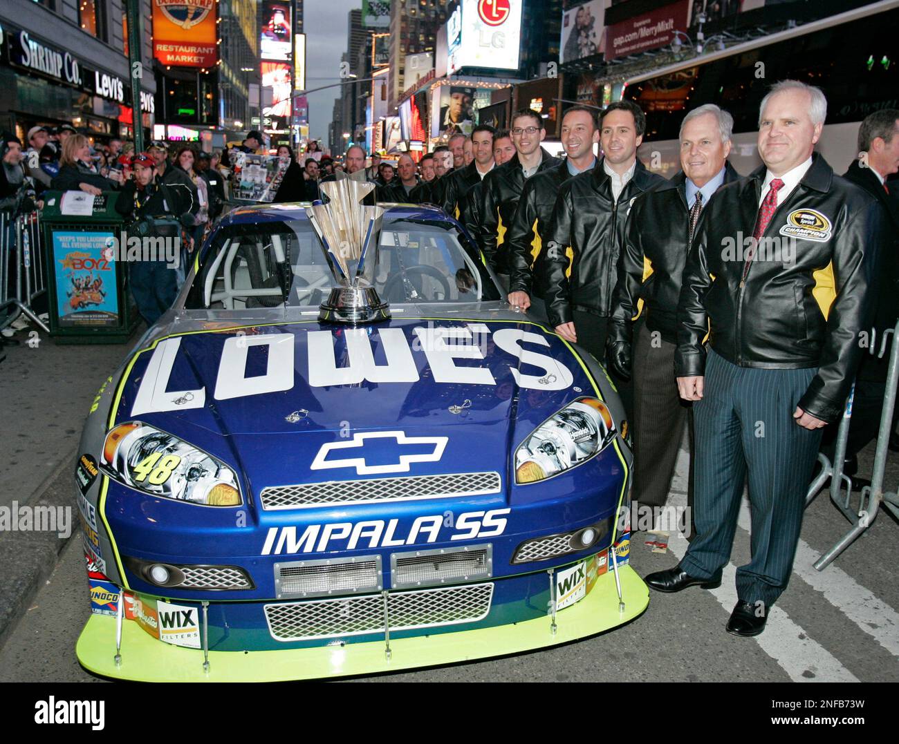 Three time NASCAR Sprint Cup Series Champion Jimmie Johnson, third from ...