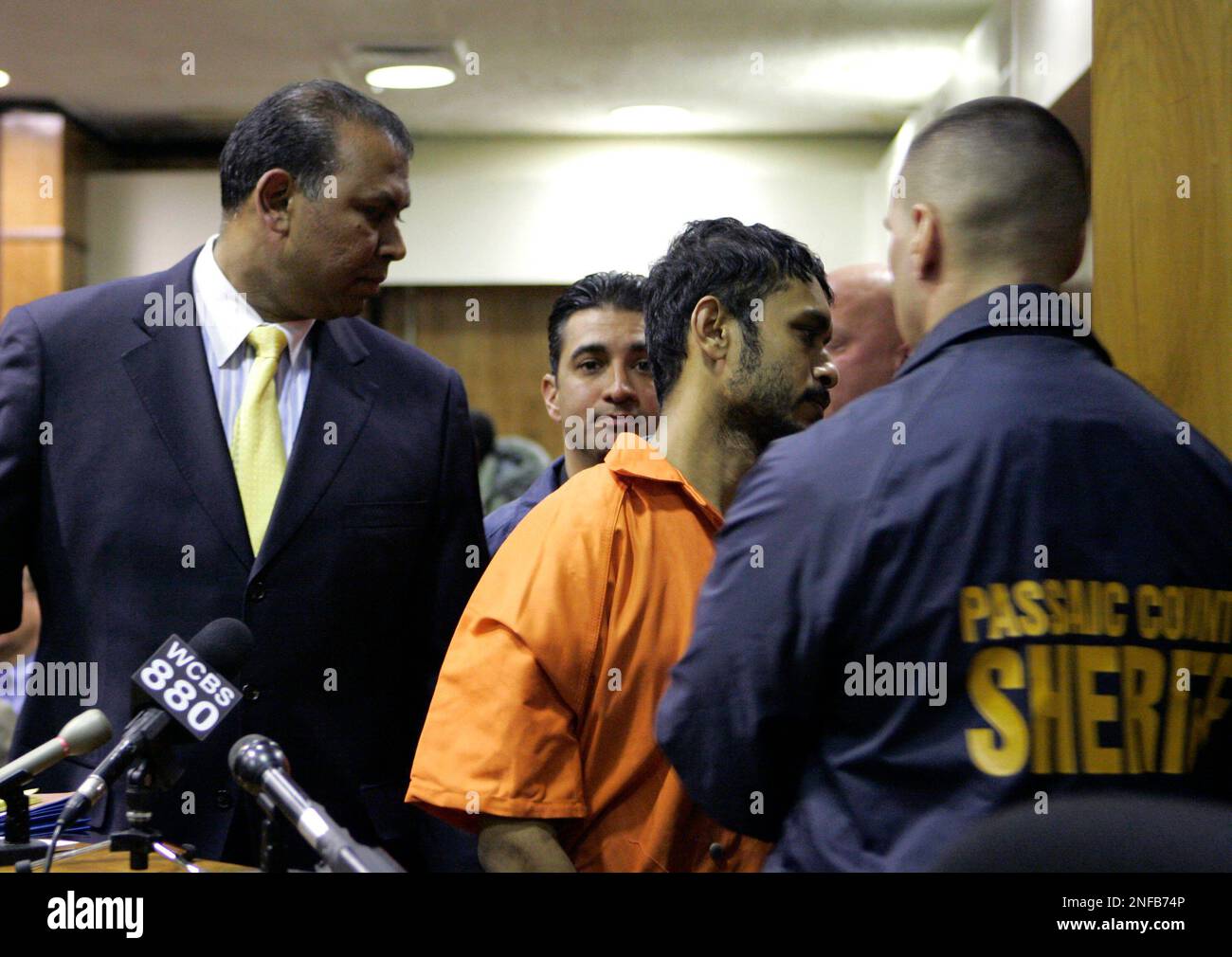 Joseph Pallipurath, second from right, leaves court with his attorney ...