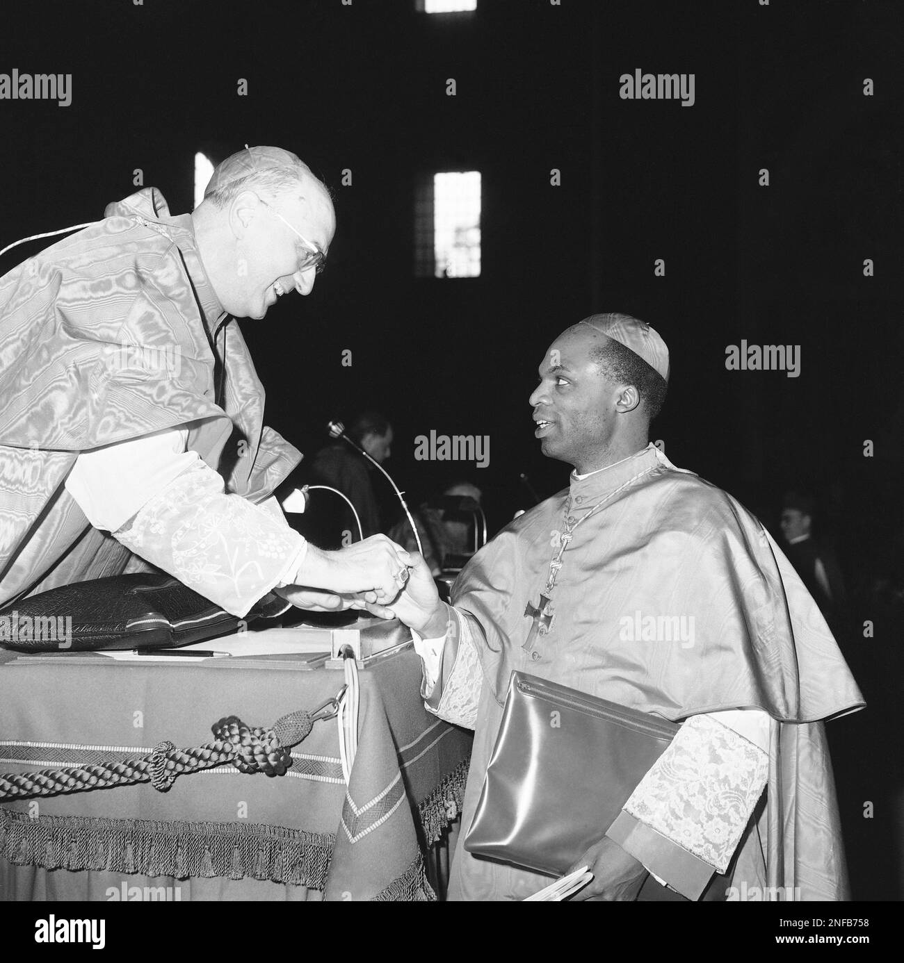 Cardinal Albert Gregory Meyer of Chicago, left, leans across desk in ...