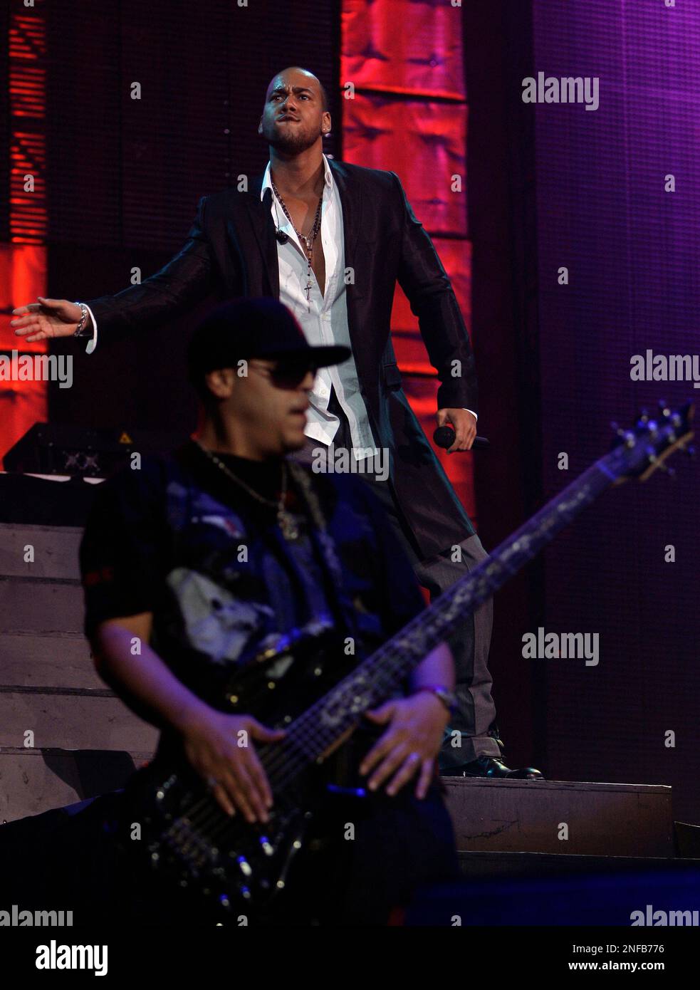 Anthony "Romeo" Santos, behind, lead singer of New York-based Dominican ...