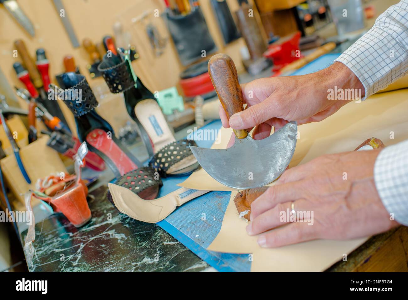 a cobbler is in workshop Stock Photo - Alamy