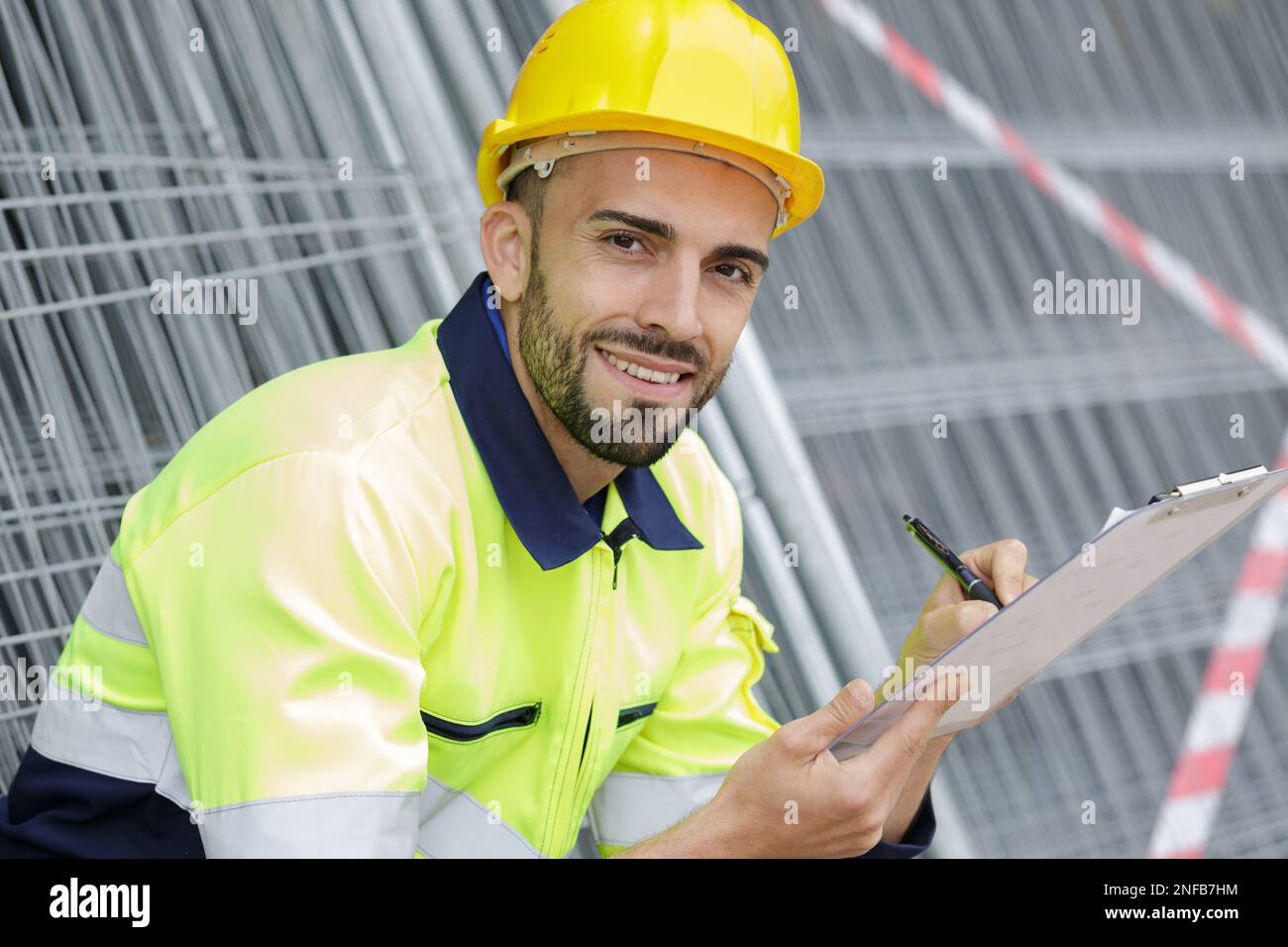 project material delivery inspector posing and smiling Stock Photo - Alamy