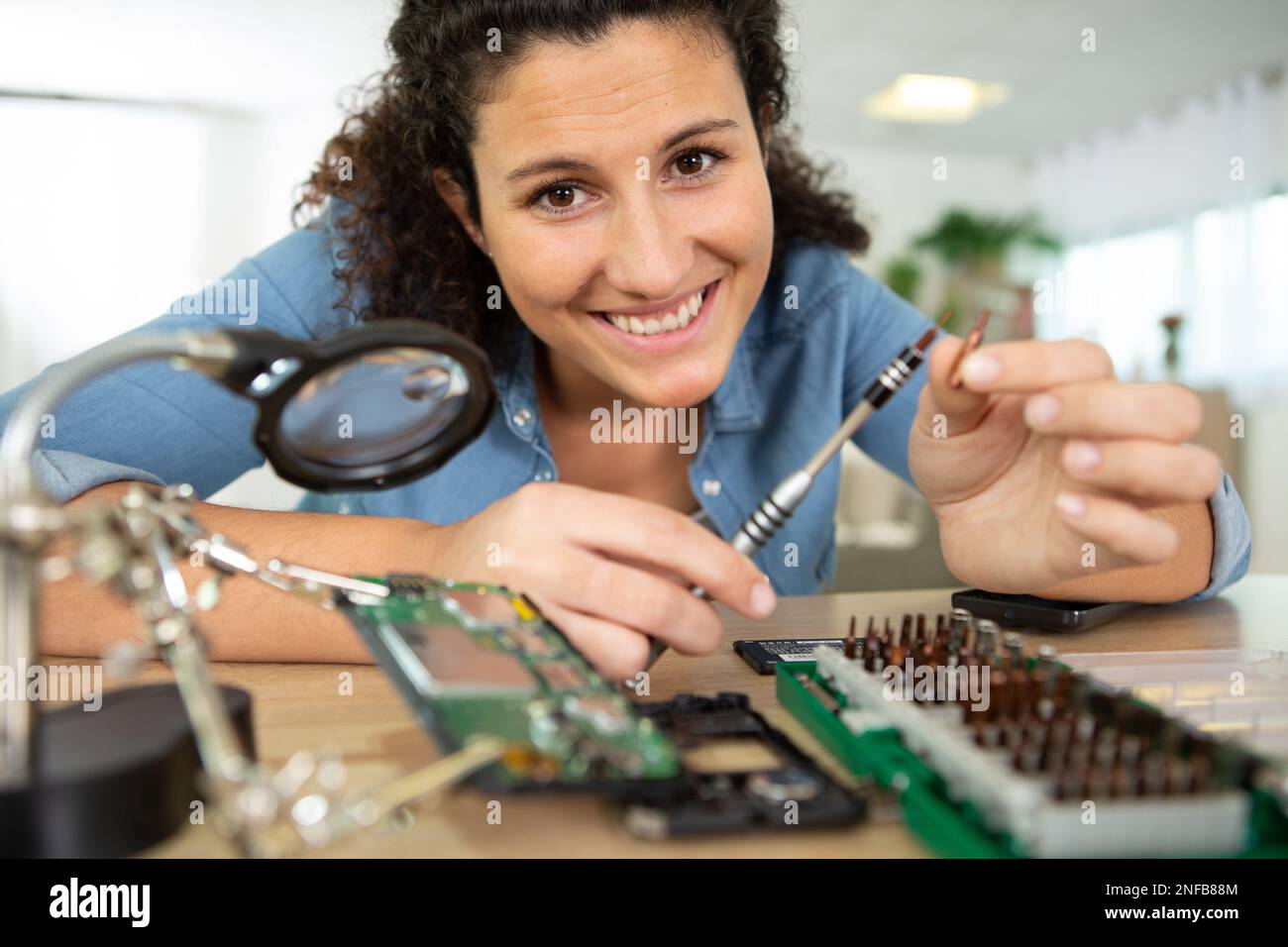 happy young woman during installation of pc Stock Photo - Alamy