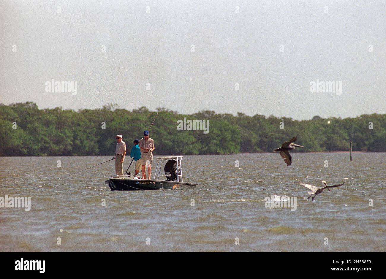 President George Bush, center, fishes in Charlotte Harbor while ...