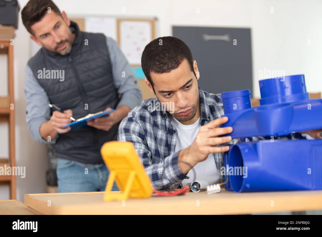 a repairman disassembling computer unit Stock Photo - Alamy