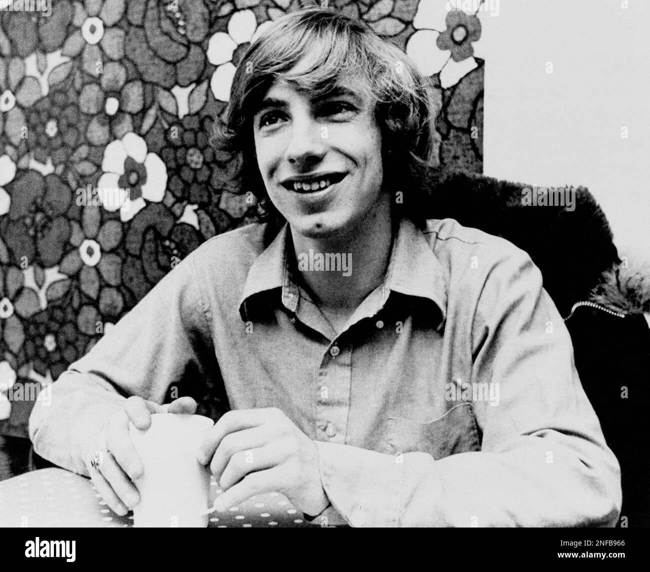 A smiling Peter Reilly relaxes at home with a cup of tea after he ...