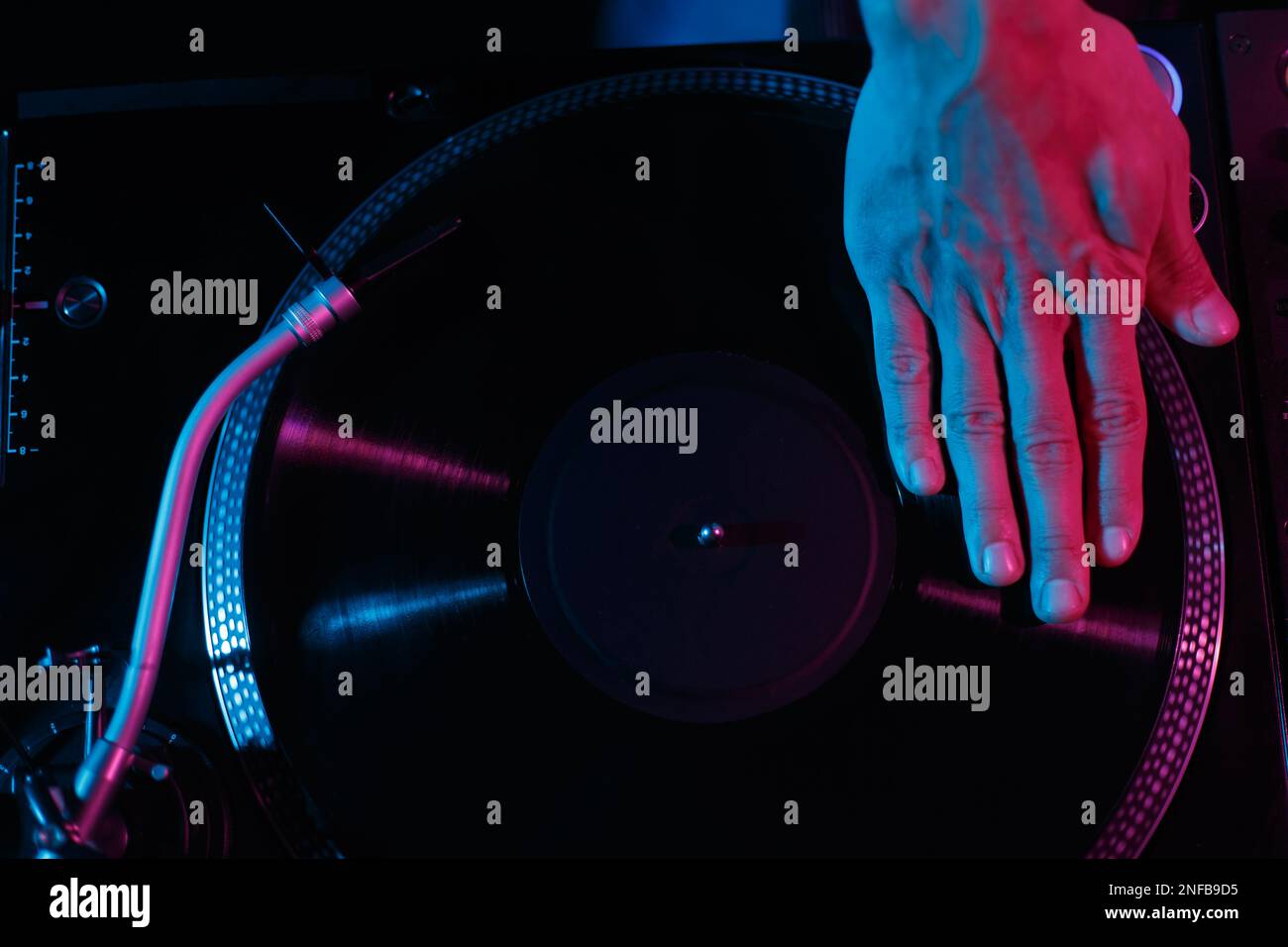 Overhead photo of hip hop disc jockey scratching vinyl record on ...