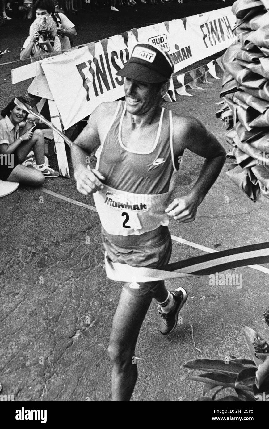 Dave Scott of Davis, Calif., breaks the tape to win Ironman Triathlon ...