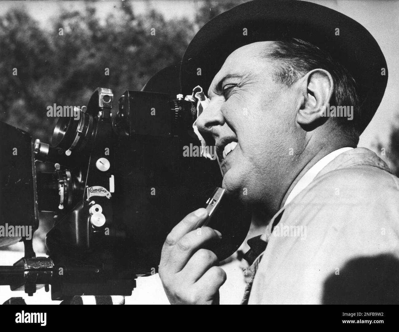 French movie producer, Jacques Tati shoots a scene, jumping in the role ...