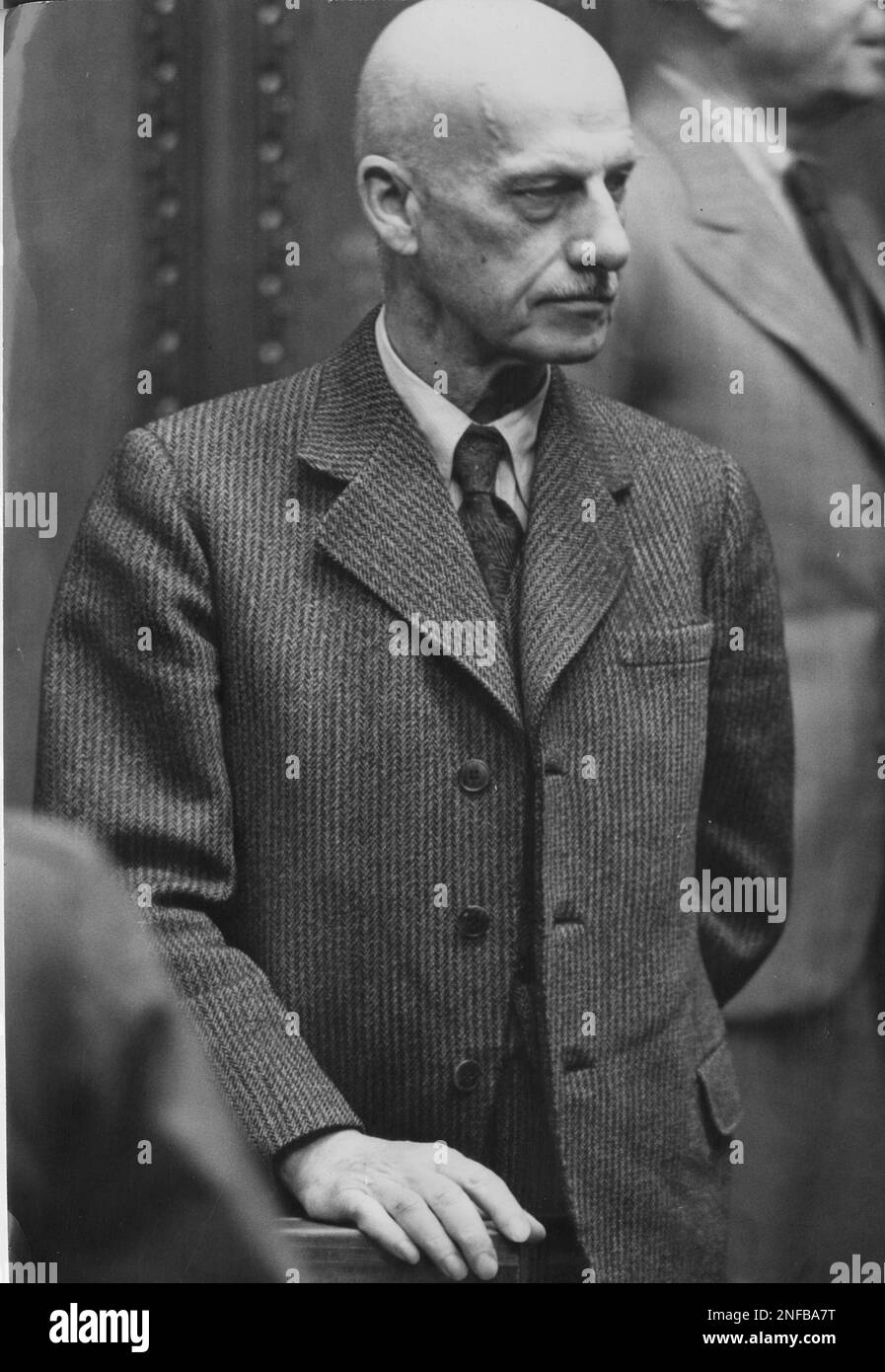 Defendant German Field Marshal, Wilhelm Leeb, wearing a suit and tie is ...