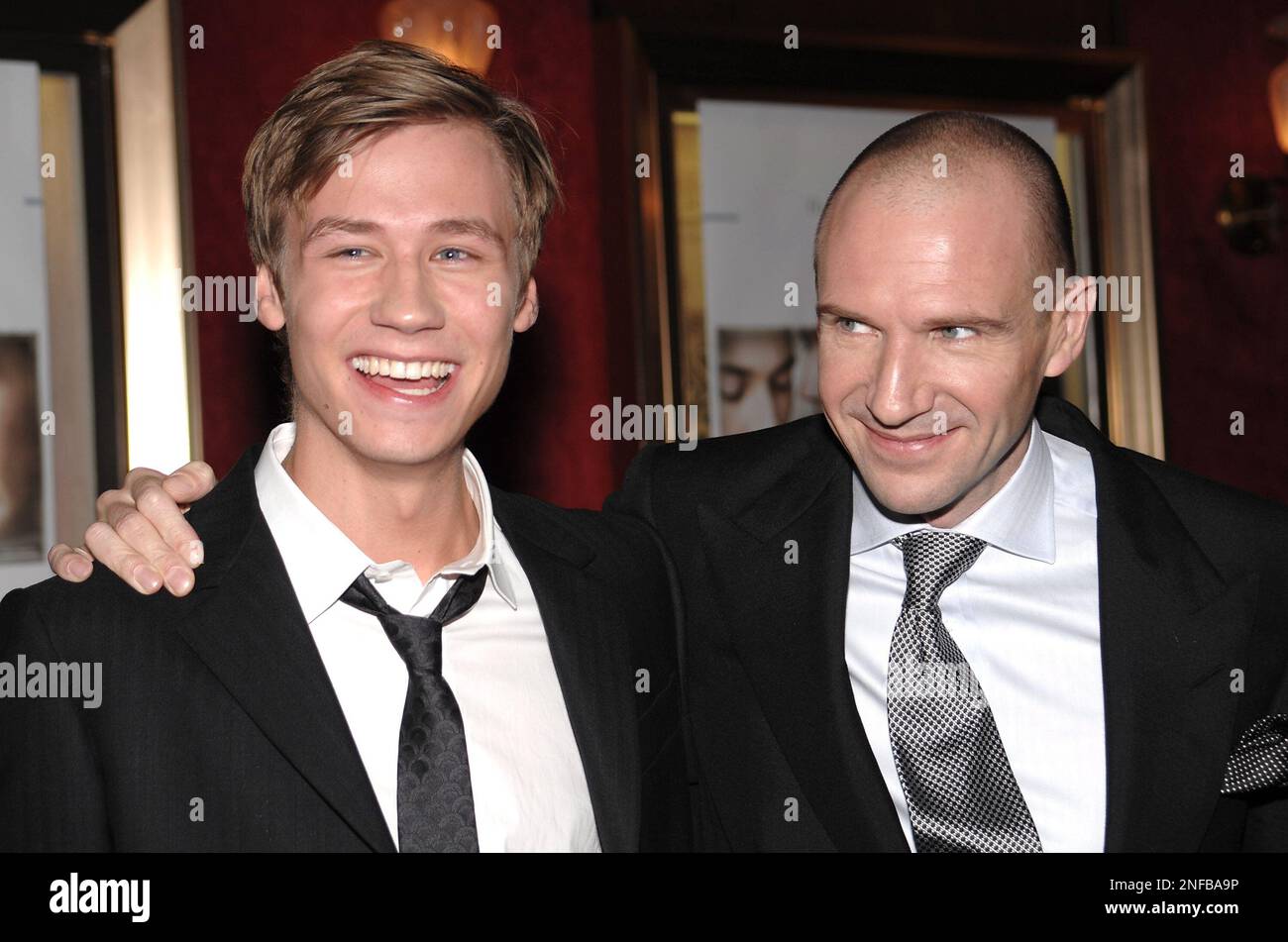 Actors David Kross, left, and Ralph Fiennes pose together at the ...