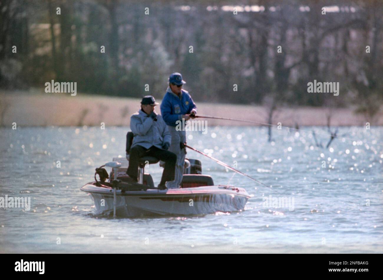 President George Bush uses a one-handed casting method during a New ...