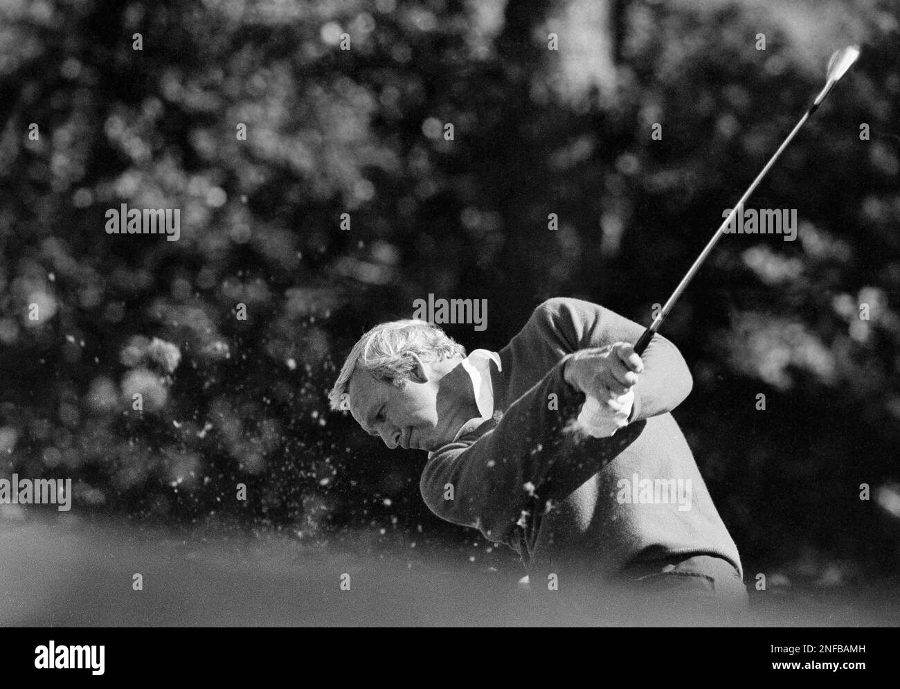 Arnold Palmer hits out of a sand trap at the first hole as the 1980 ...