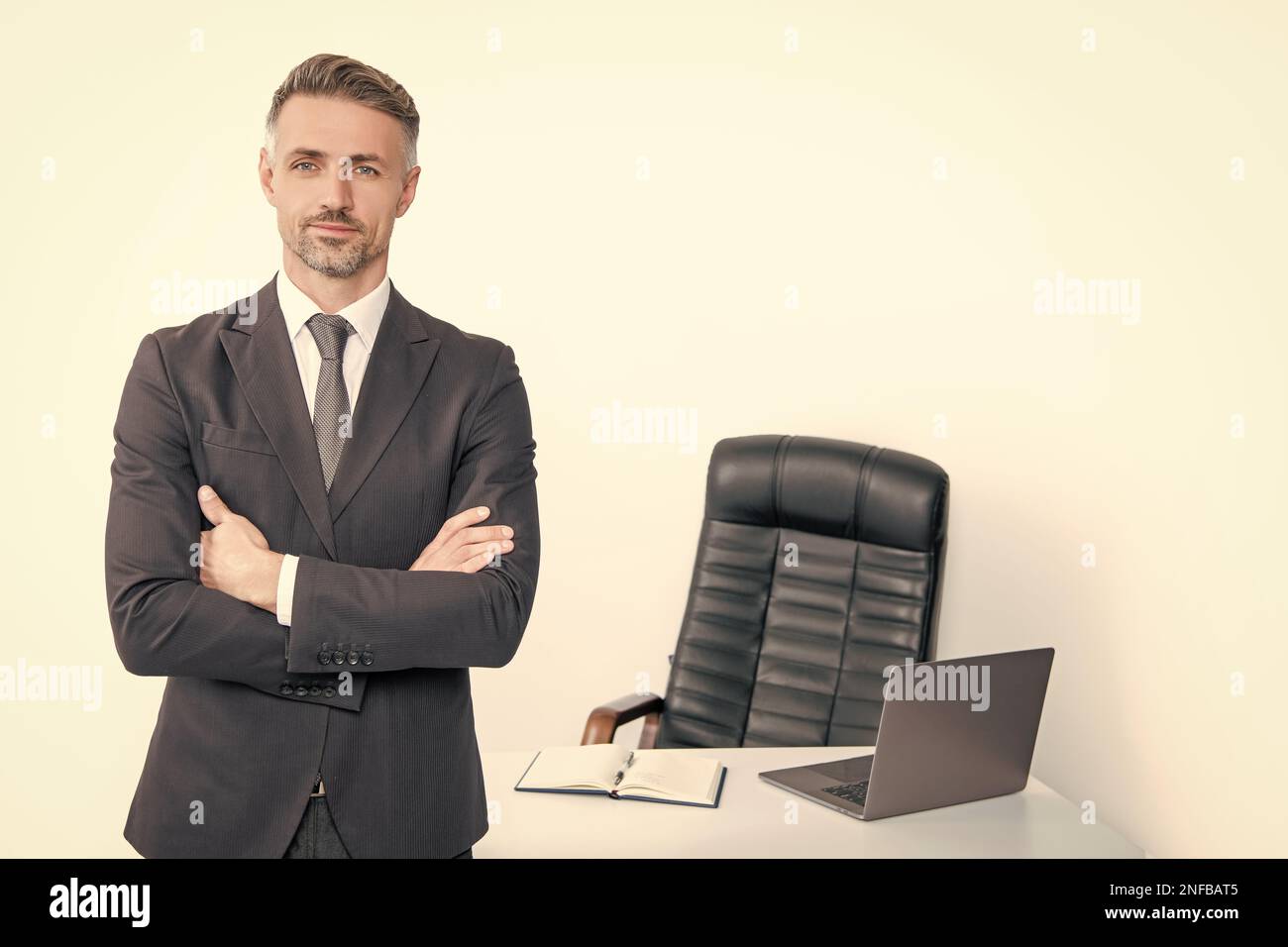 mature boss wear suit in office on white background Stock Photo - Alamy