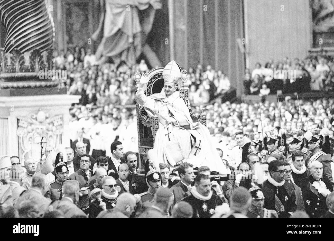 Pope Paul VI, blesses and crowd of about 3,000 people as he is carried ...