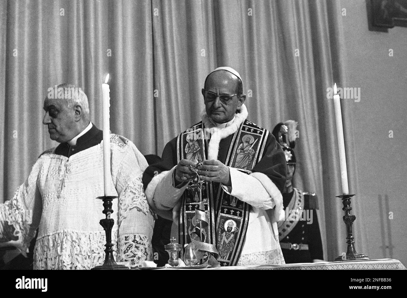 Pope Paul VI, right, blesses a golden rose which will be sent to the ...