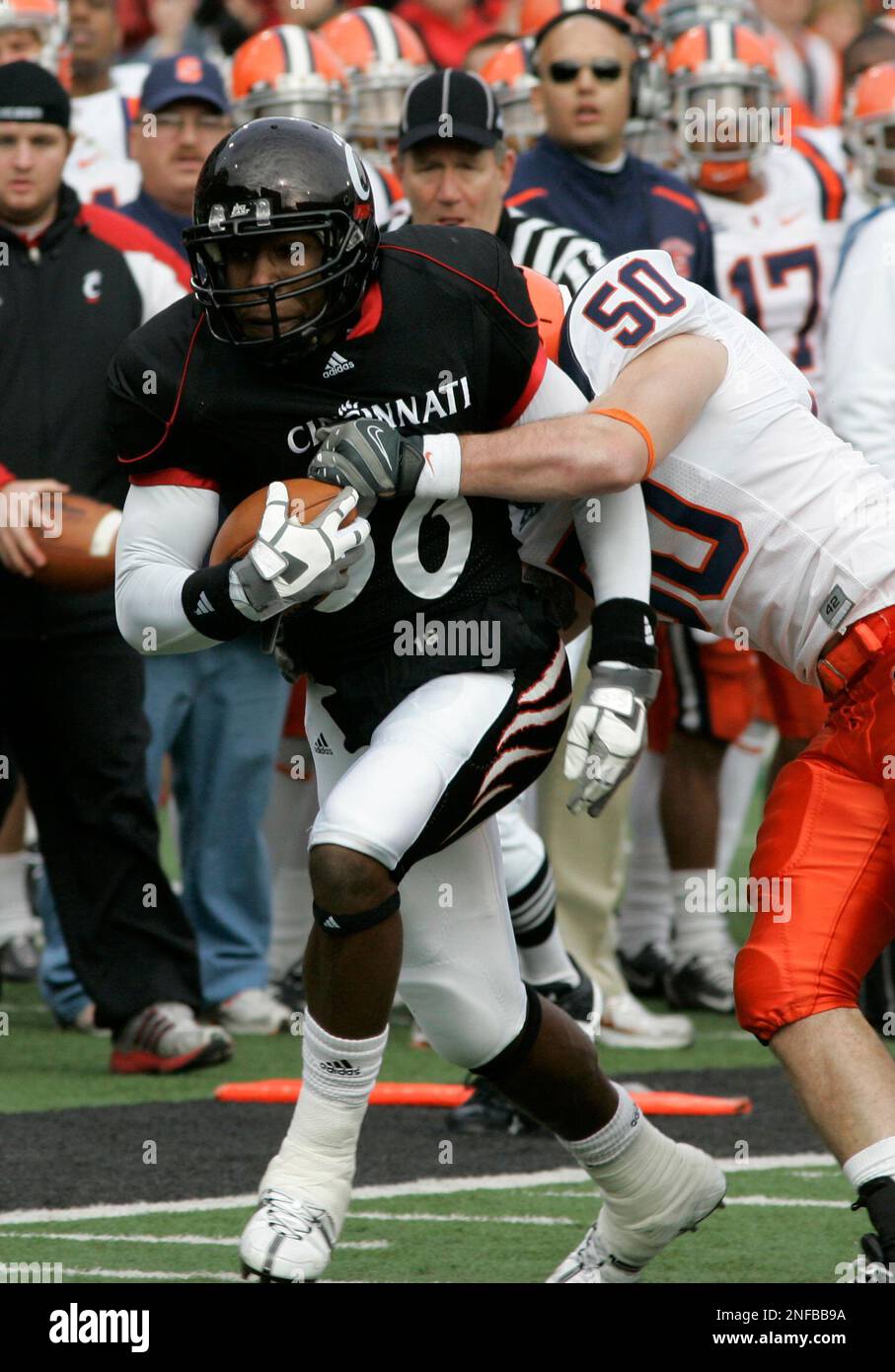Cincinnati receiver Dominick Goodman (36) against Syracuse defender ...