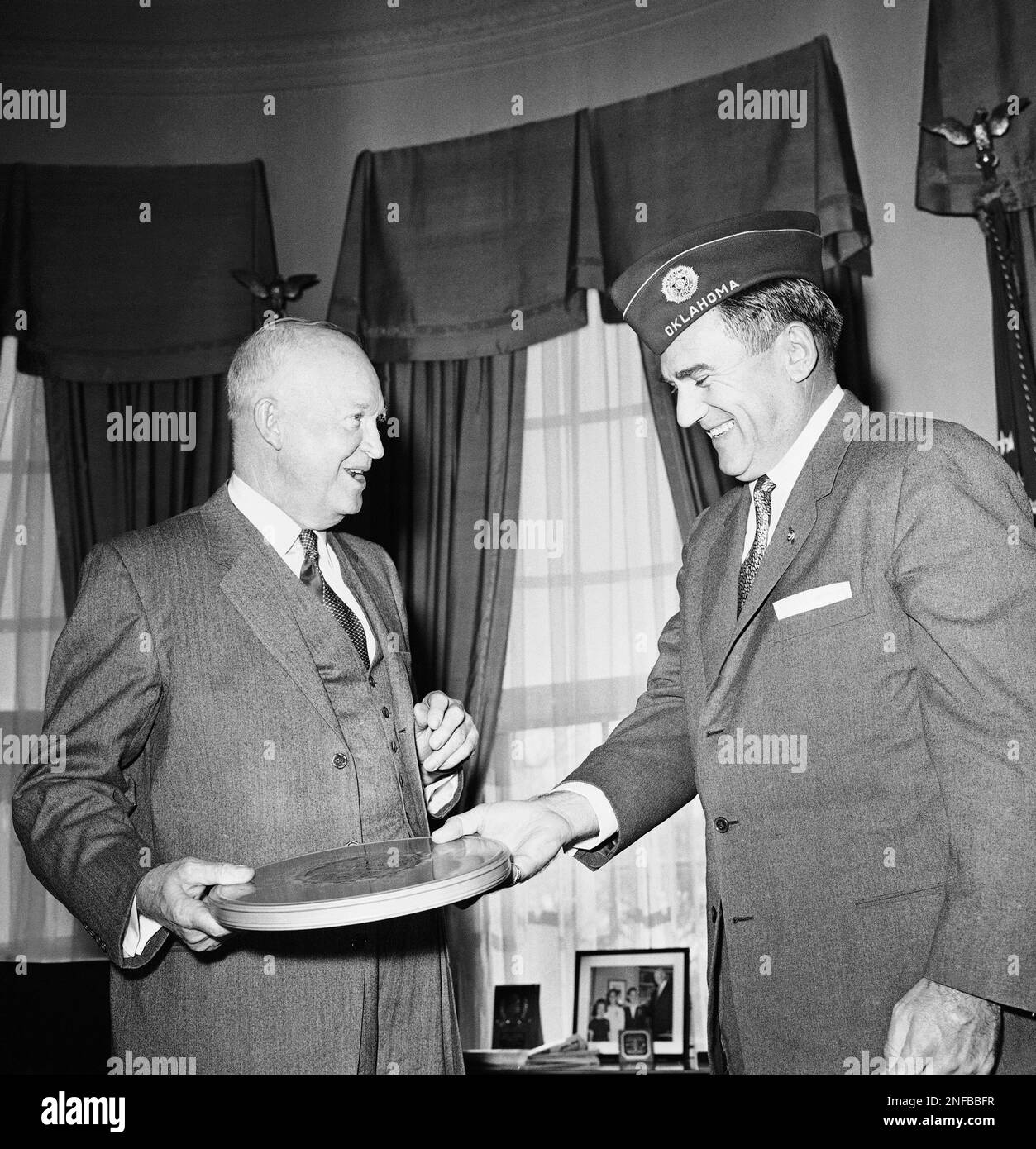 President Dwight Eisenhower receives a reel of film from Legion ...