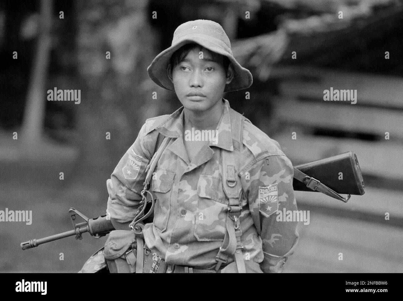 An ethnic Karen insurgent armed with a U.S. Made M-16 automatic rifle ...