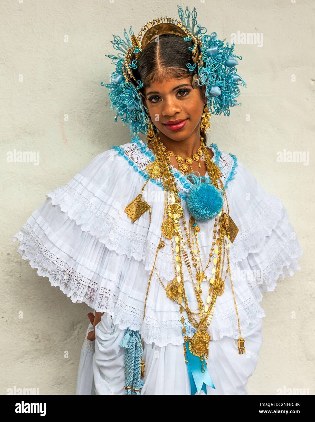 A young Panamanian girl in a colorful traditional pollera, the national ...