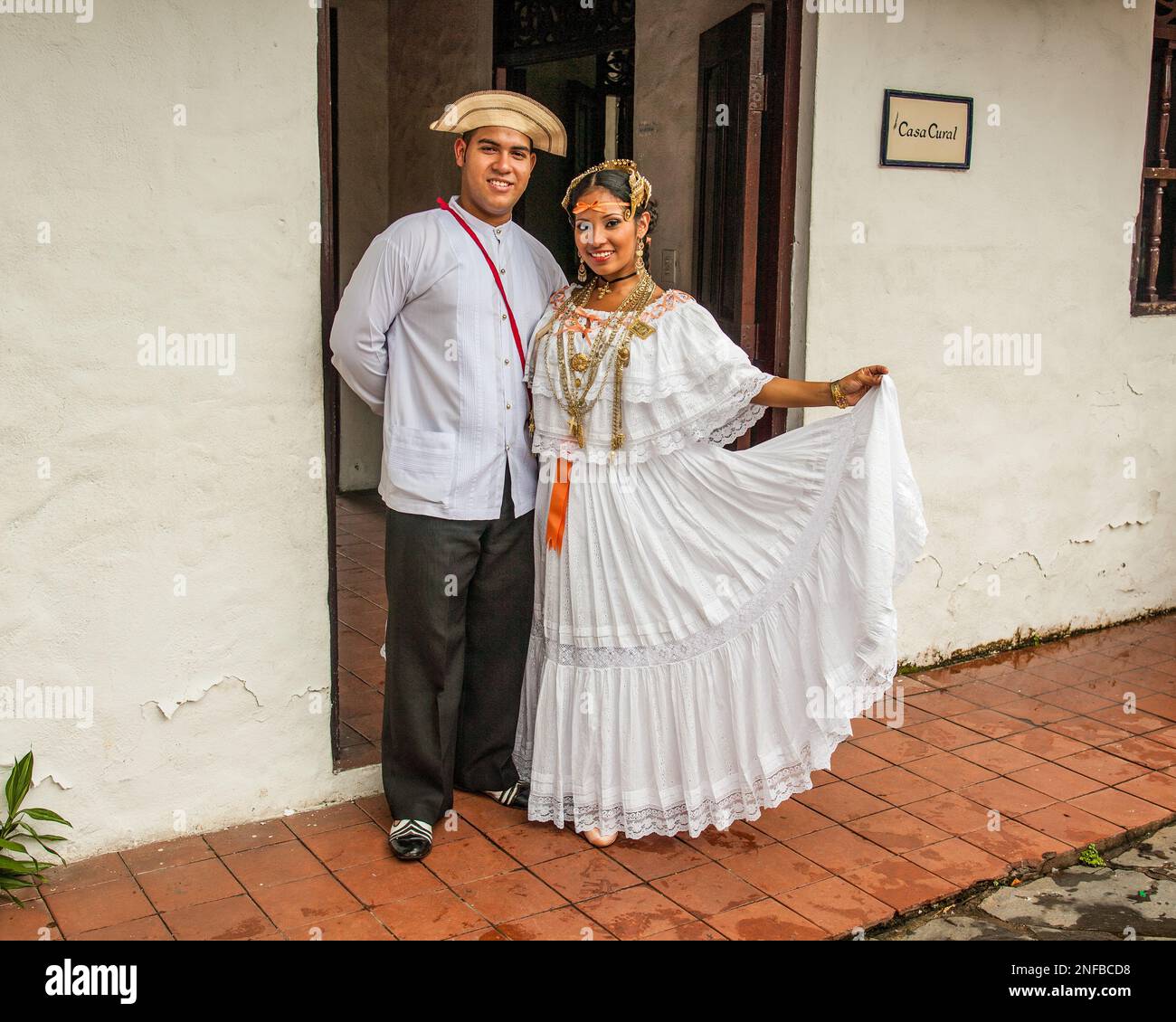 A Panamanian man and woman in traditional dress. The woman wears a ...