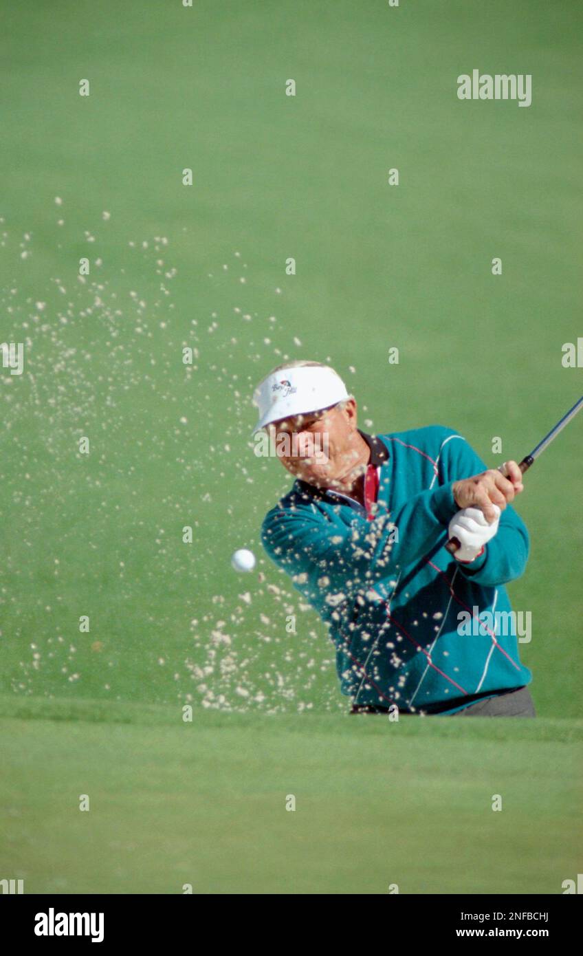 Four-time Masters winner Arnold Palmer blasts out of the bunker on the ...