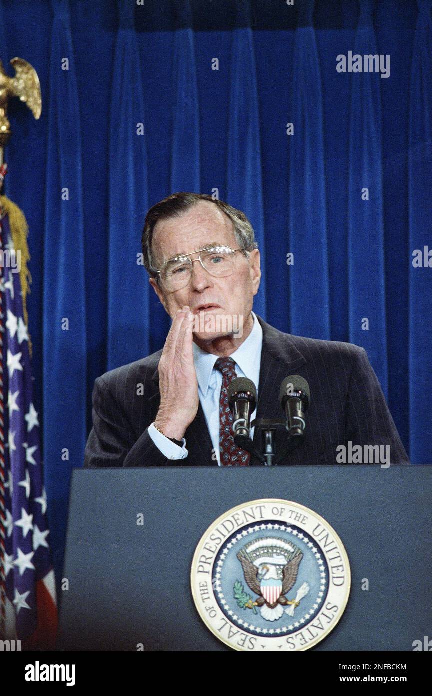 President George Bush gestures during an address at the White House ...