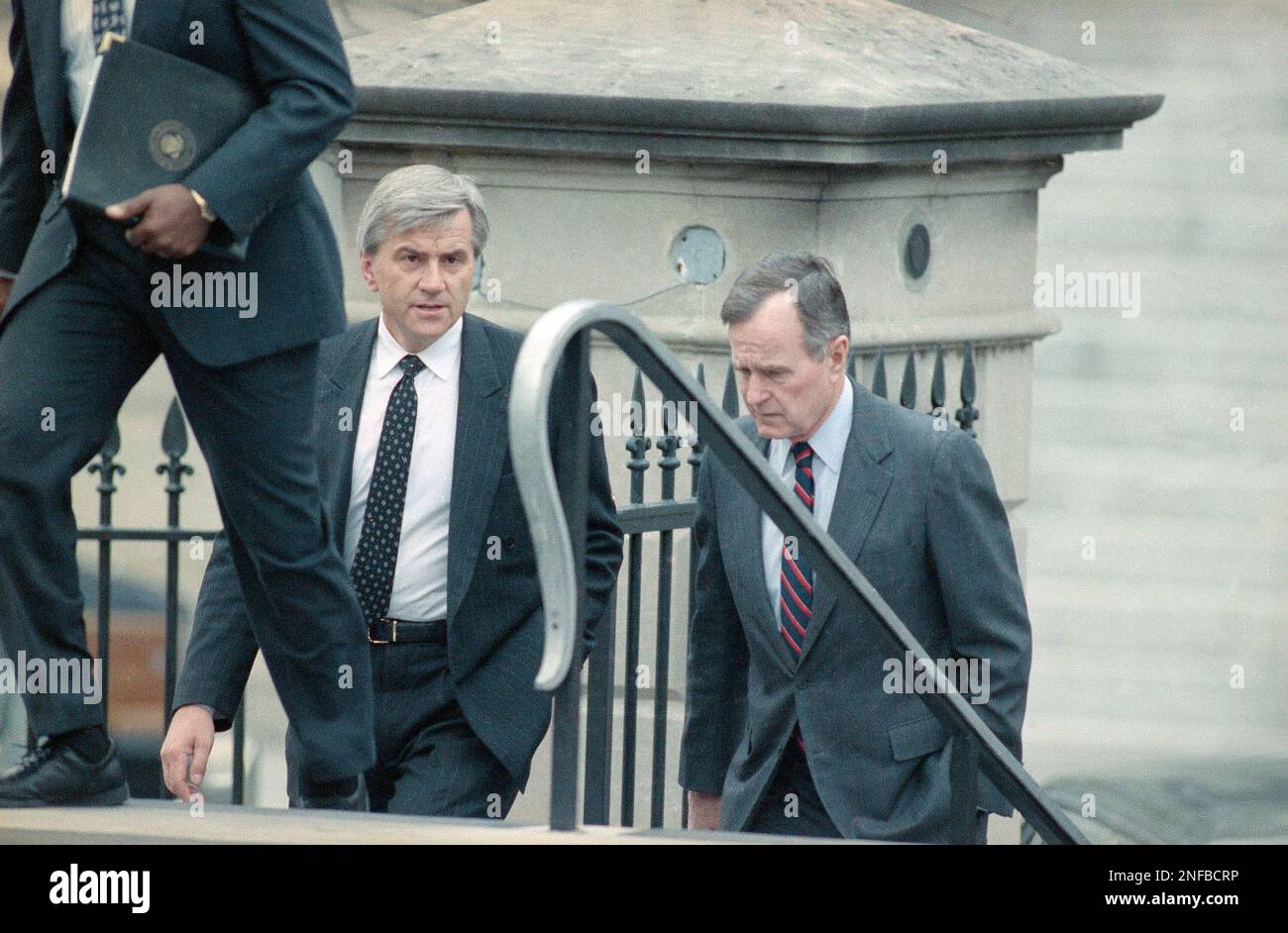 President George Bush, with media adviser Sig Rogich, returns to the ...
