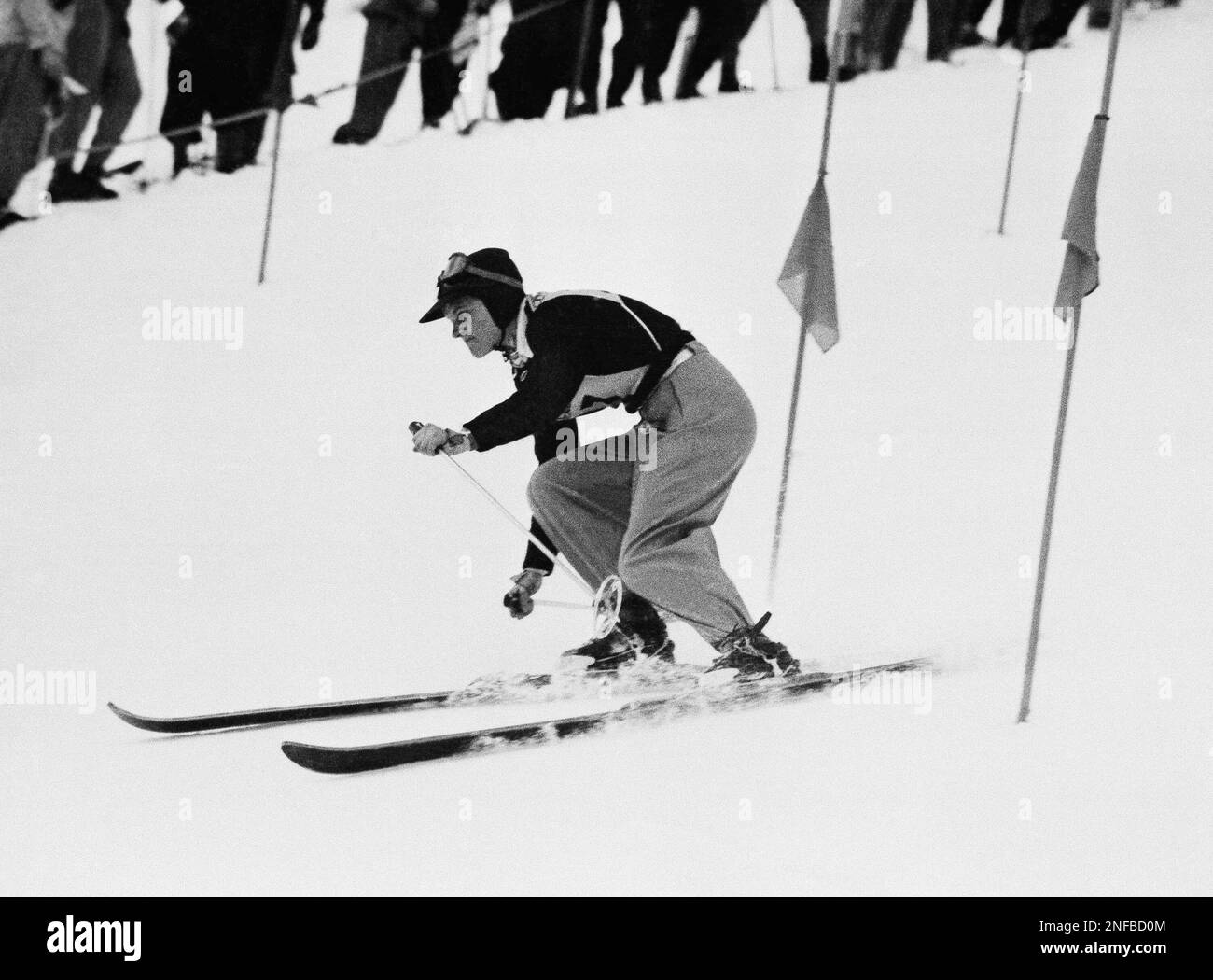 Andrea Mead, 15, of Rutland, Vt., speeds past flag markers during ...