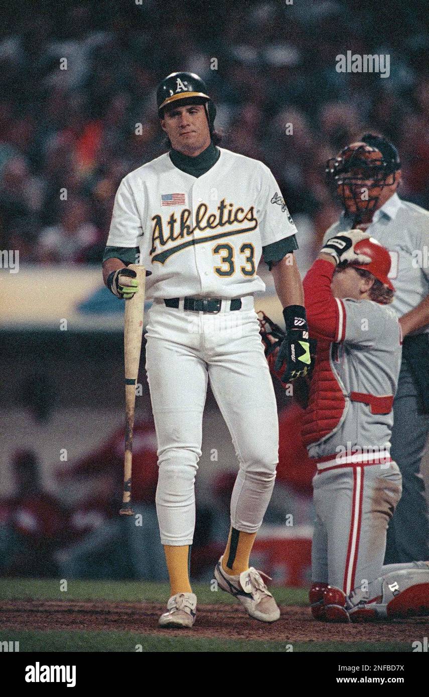 Frustrated Oakland Athletics slugger Jose Canseco (33) reacts to a ...