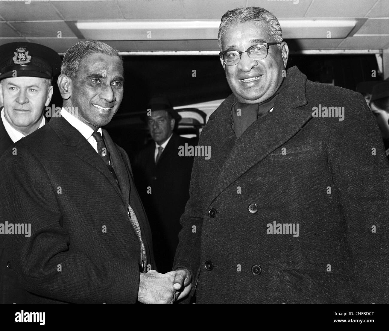 Prime minister of Ceylon, Dudley Senanayake, right, is greeted by ...