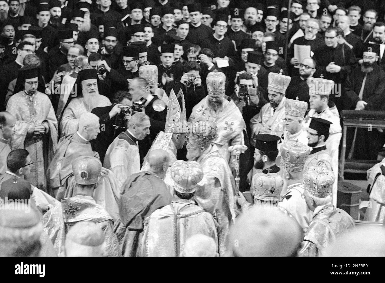 Pope Paul VI, center left, embraces Melchite Patriarch Maximos IV Saigh ...