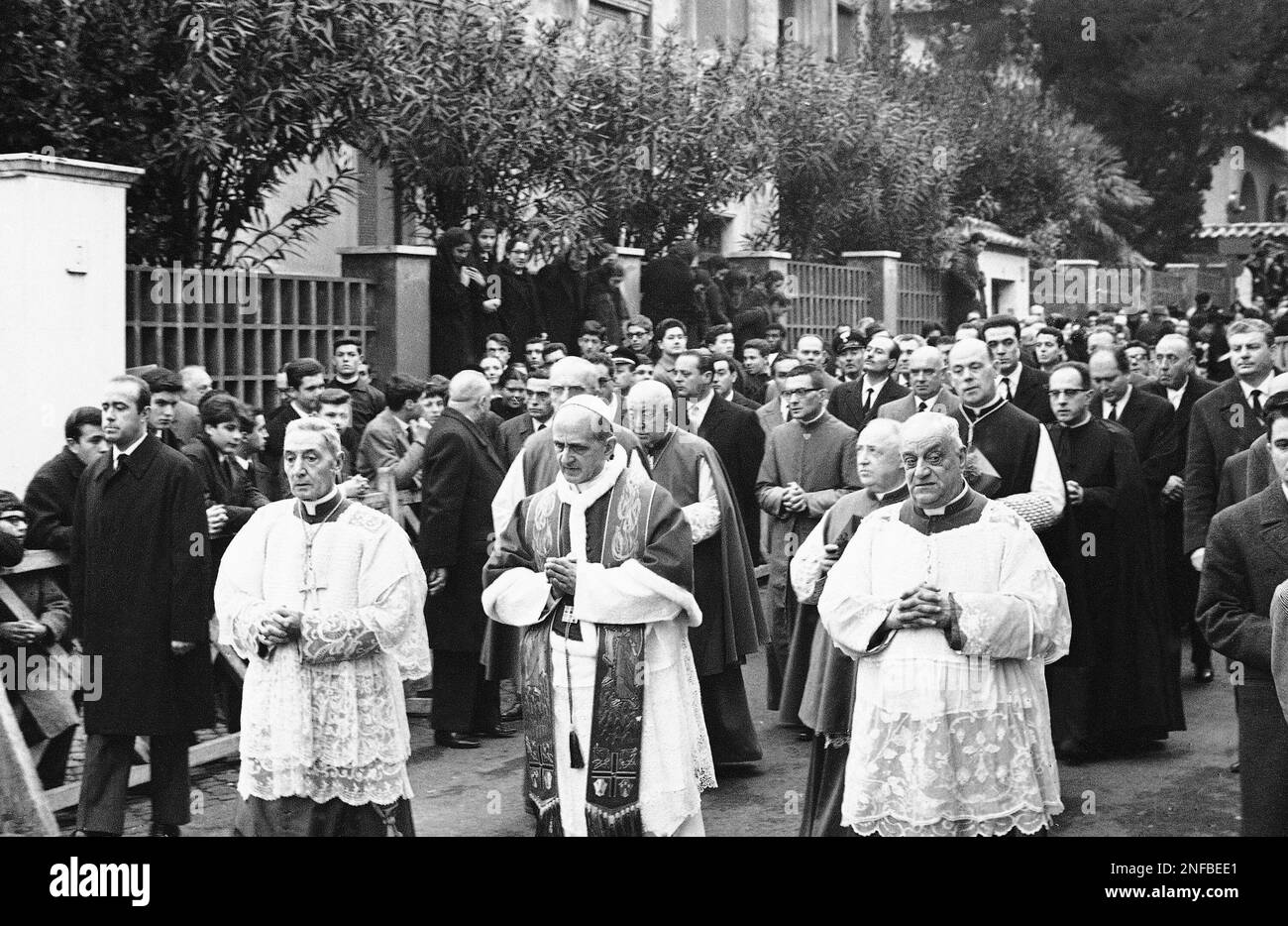 Pope Paul VI, accompanied by Msgr. Enrico Dante, left, and Msgr ...