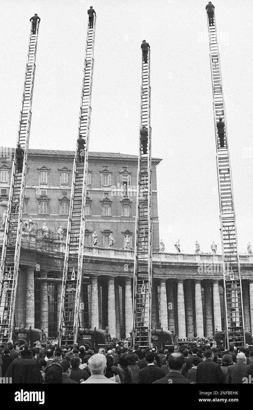 Firemen perch on 90-foot aerial ladders in St. Peter's Square, Vatican ...