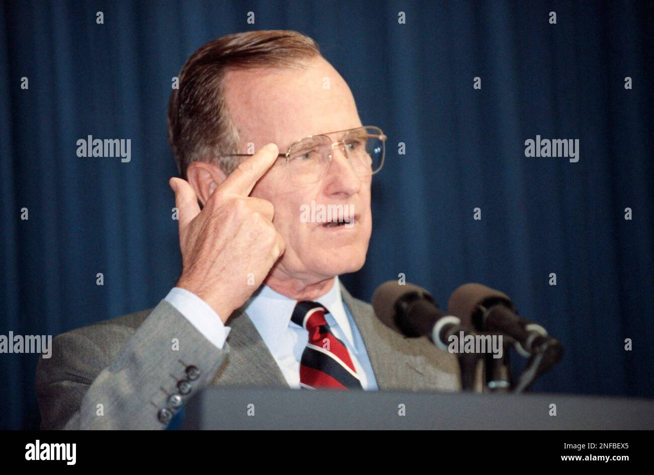 U.S. President George H. Bush gestures as he addresses executives of ...