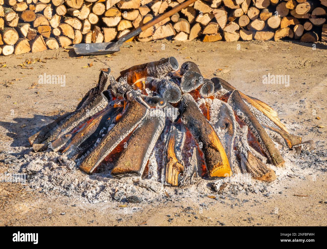 Top of a large circular bonfire packed with firewood on the sides that ...