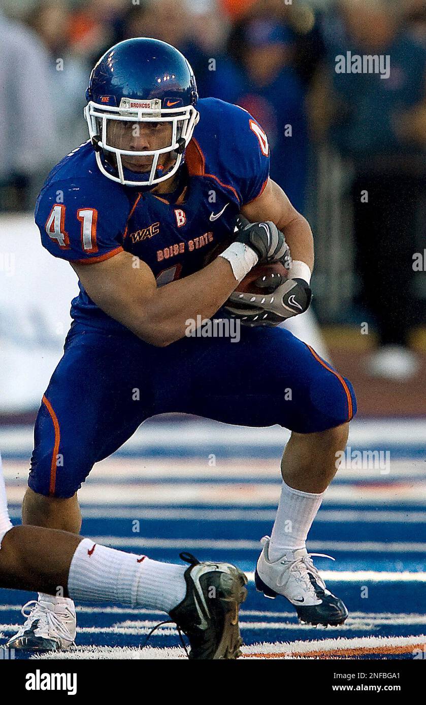 Boise State's Ian Johnson (41) rushes against the defense of Fresno ...