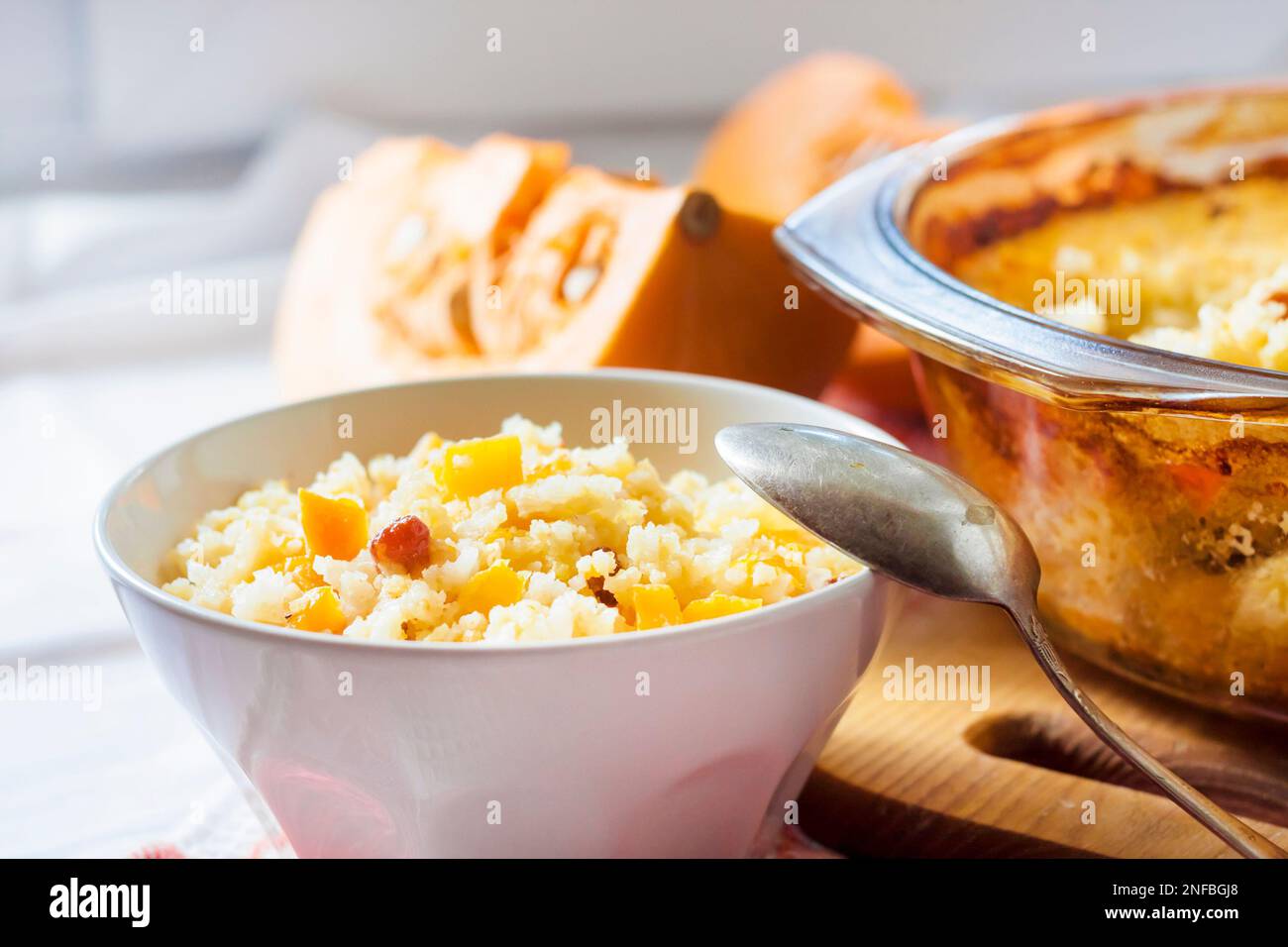 Sweet milky millet and rice porridge with pumpkin and raisins Stock ...