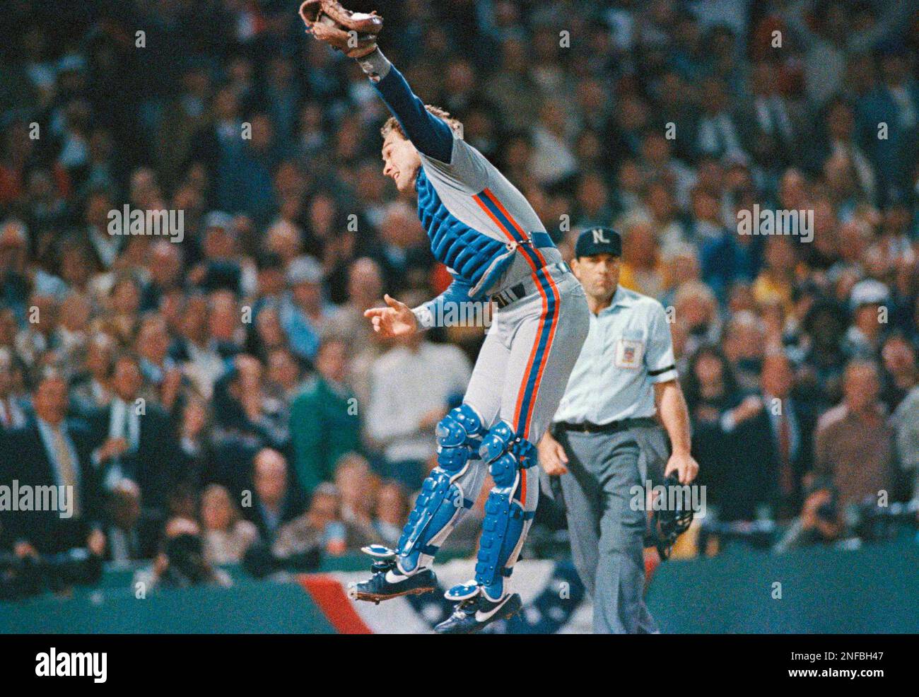 New York Mets catcher Gary Carter lunges in the air to field the late ...